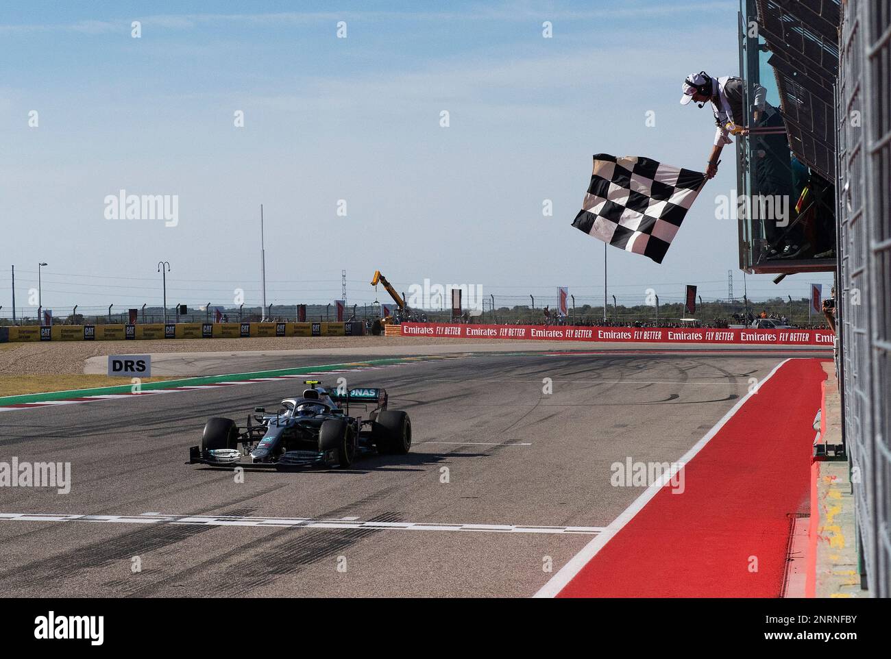 Mercedes driver Lewis Hamilton, of Britain, crosses the finish line to ...