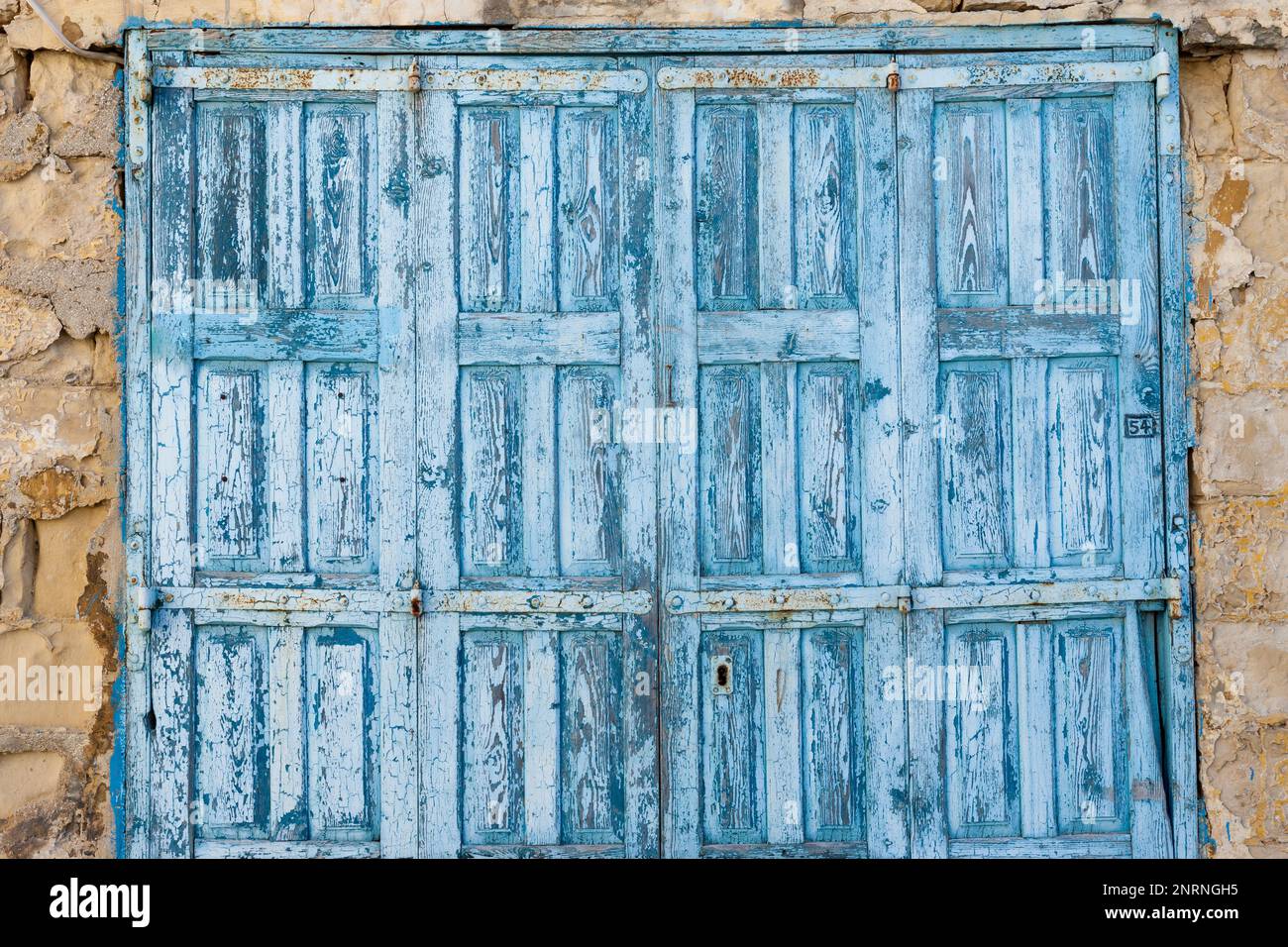 Old Rustic, blue "panelled wood door Stock Photo - Alamy