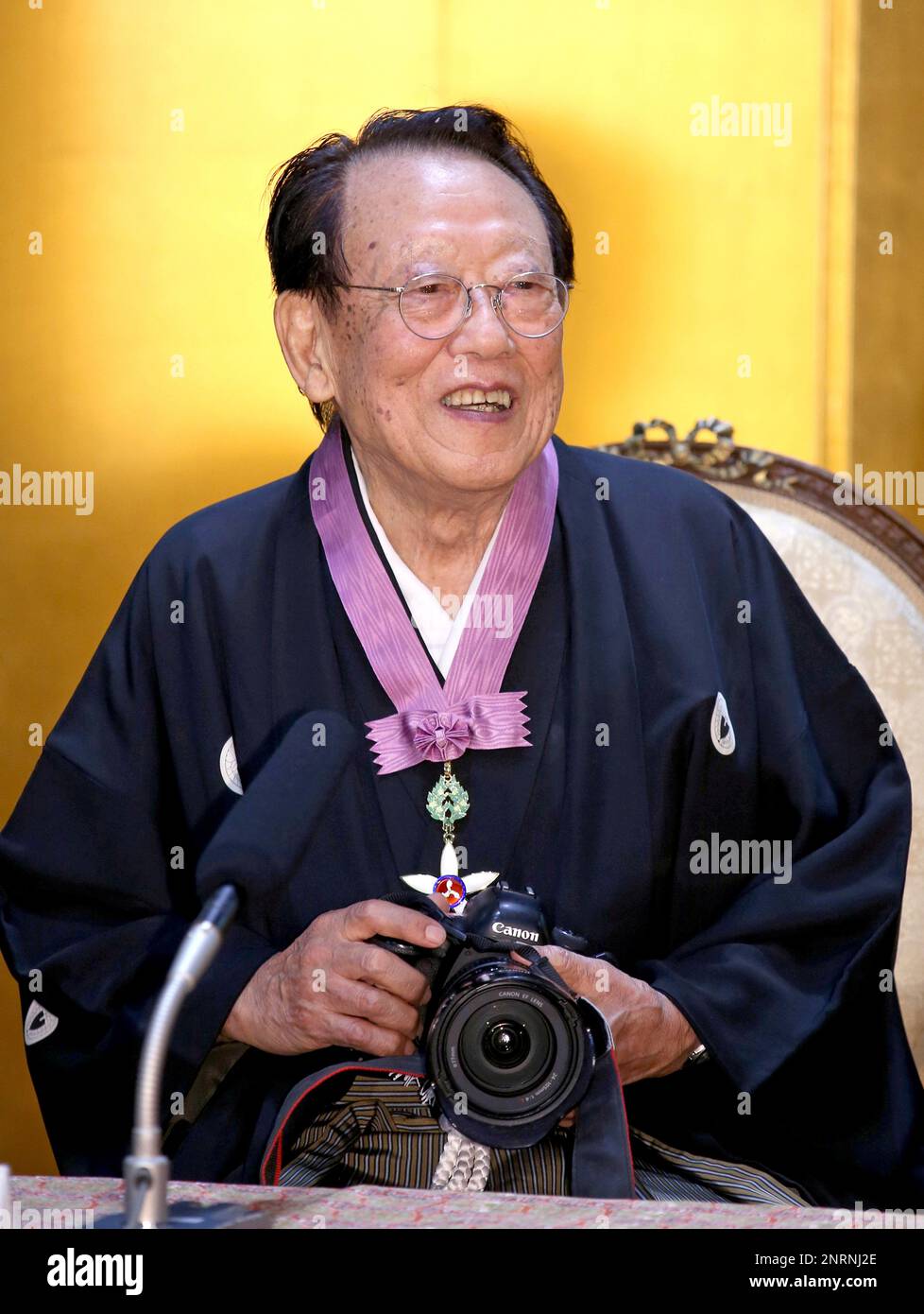 Japanese photographer Takeyoshi Tanuma attends a press conference after ...