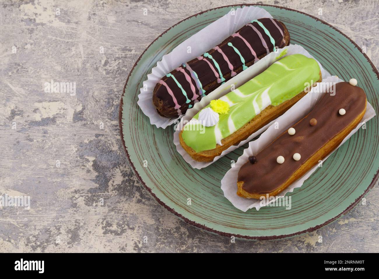 Green plate with delicious colorful green and brown glazed french ...