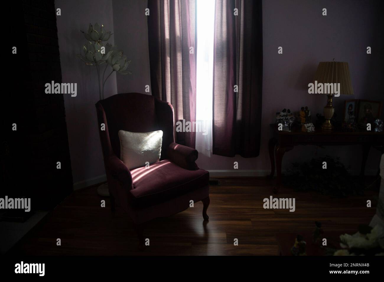 In this Sept. 11, 2019 photo, sunlight peeks through a window in the ...