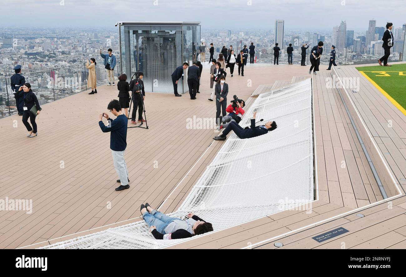 Visitors climb up " Shibuya Sky" on the rooftop of Shibuya Scramble ...