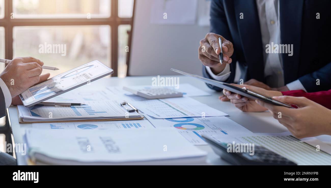 Business concept. Business people discussing the charts and graphs ...