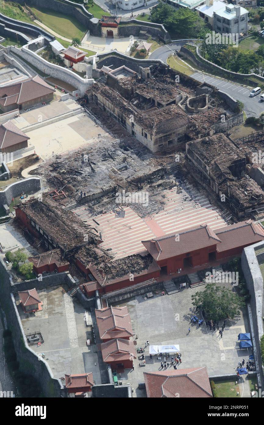 An aerial photo shows local police officers and firefighters inspecting ...