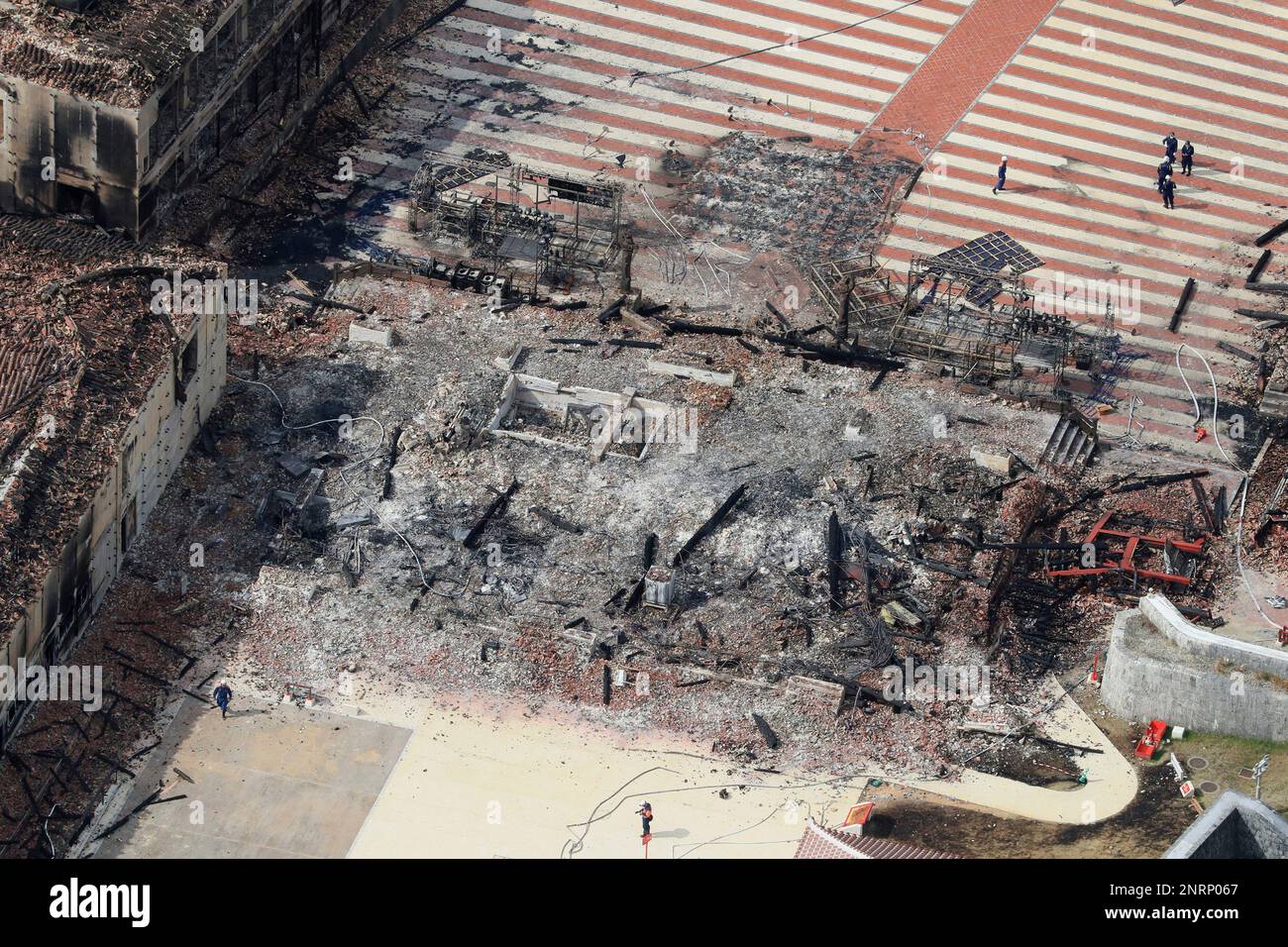 An aerial photo shows local police officers and firefighters inspecting ...