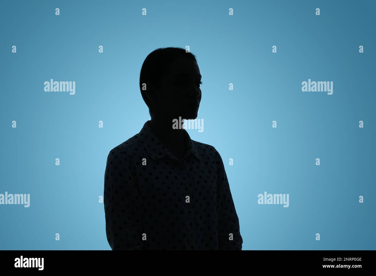Silhouette of anonymous woman on light blue background Stock Photo - Alamy
