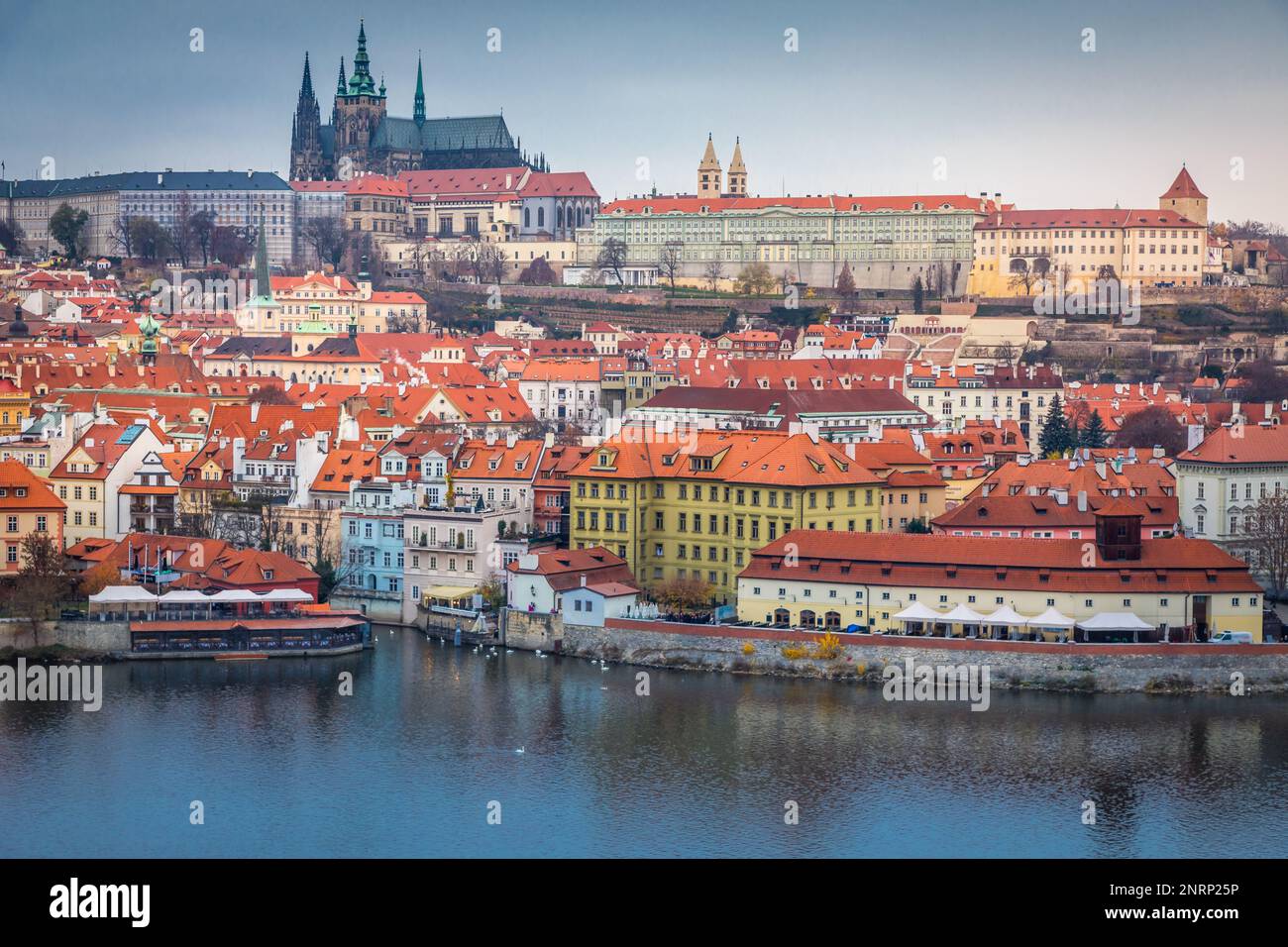 Panoramic view over the cityscape of Prague and Vltava river at dramatic sunset, Czech Republic ...