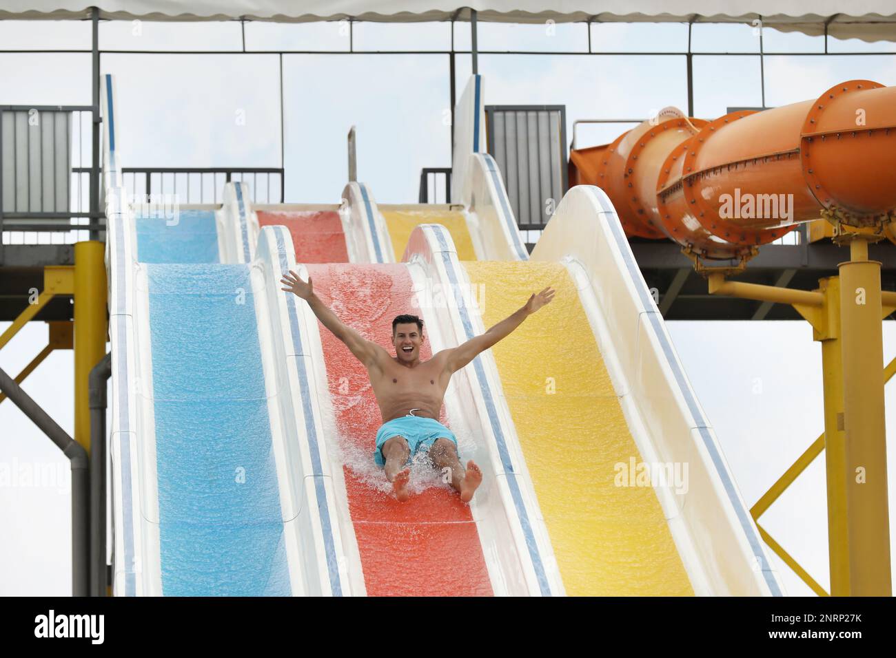 Man sliding on slide hi-res stock photography and images - Alamy