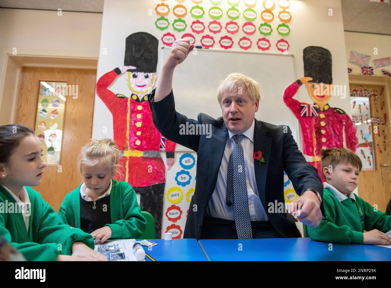 Britain's Prime Minister Boris Johnson looks at old photographs of ...