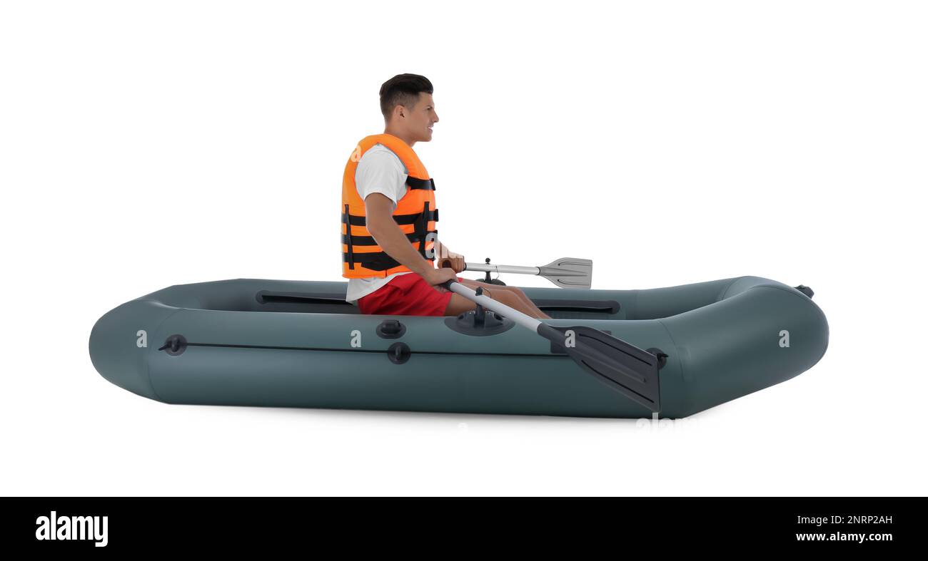 Man in life vest rowing inflatable rubber boat on white background ...