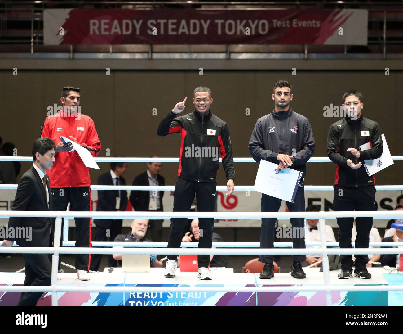 Japan's Sewon Okazawa (2nd from L) celebrates on the podium of the ...