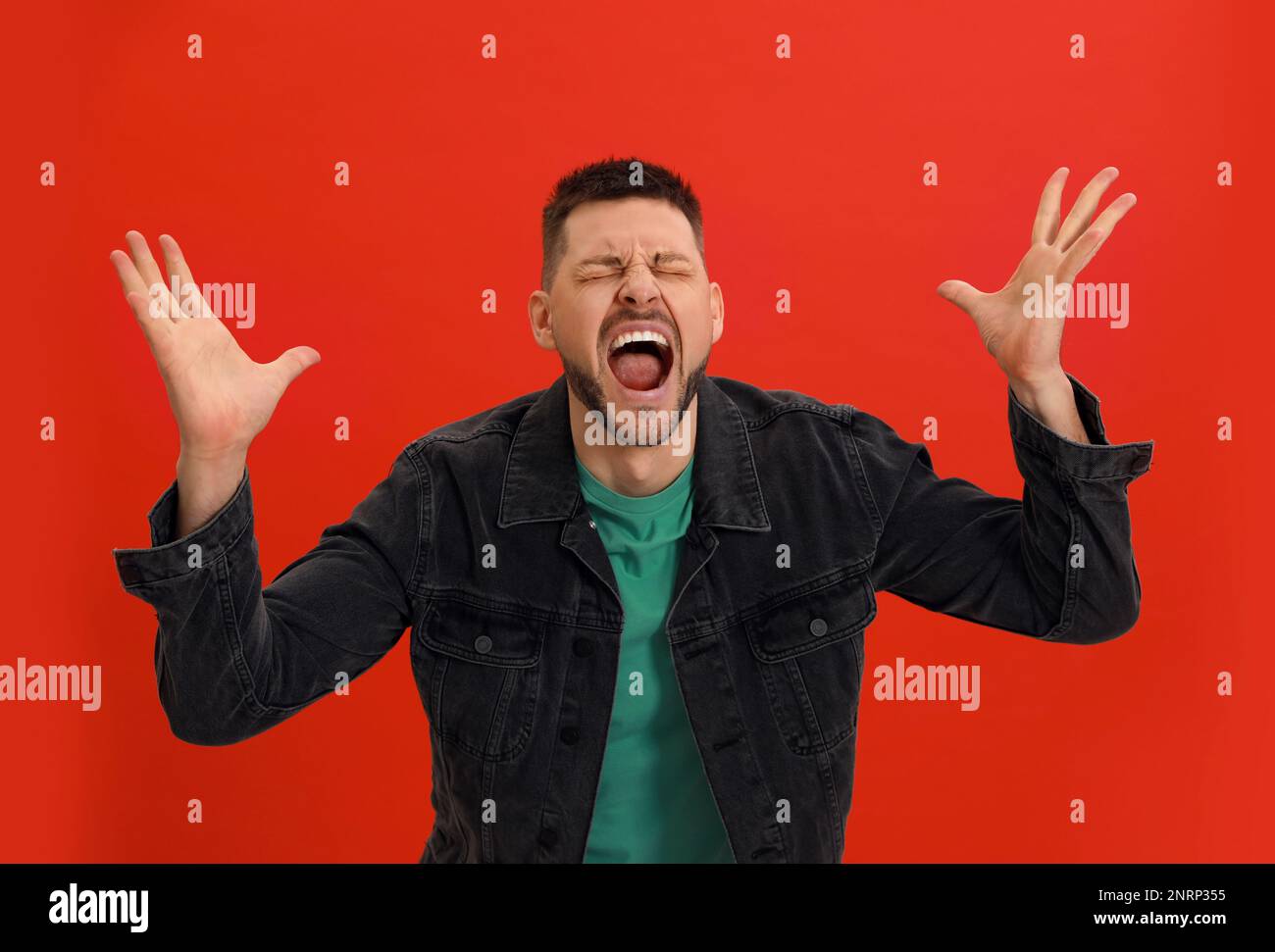 Angry man yelling on red background. Hate concept Stock Photo - Alamy