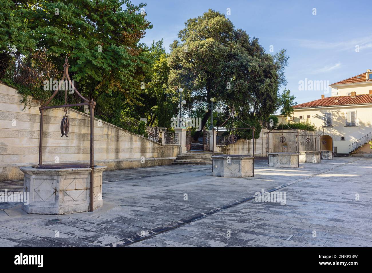 View of Five Wells Square with five wells lined up one after the other ...
