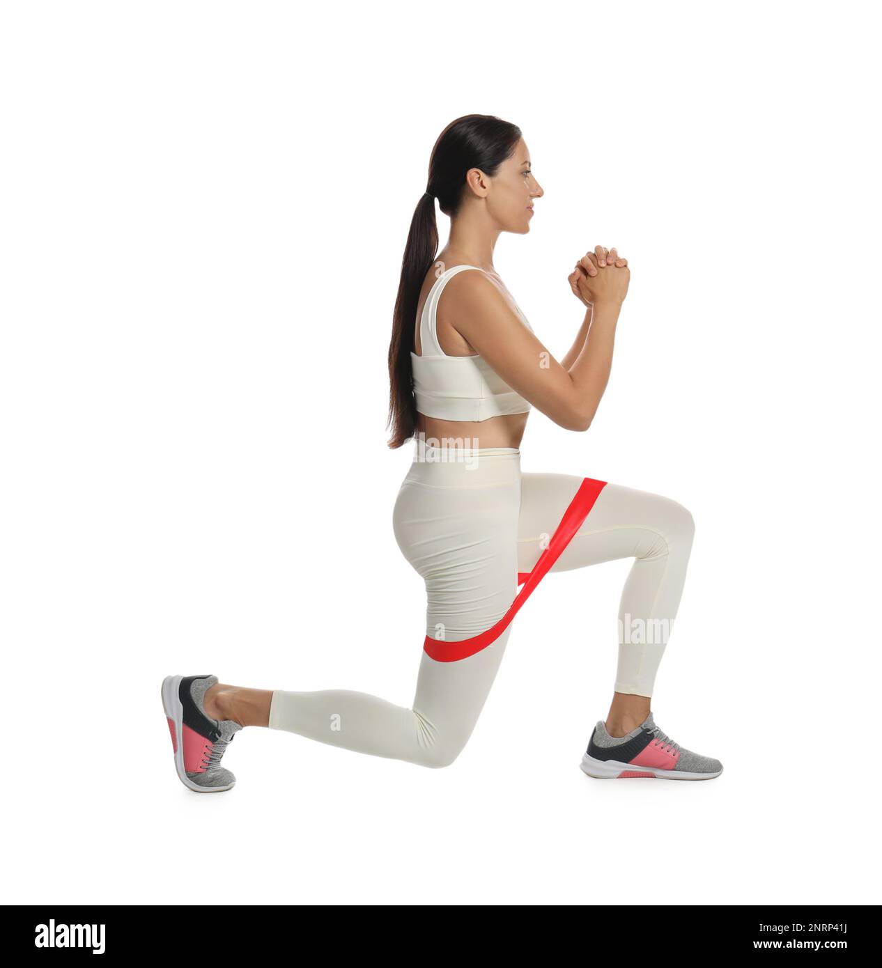 Woman doing lunges with fitness elastic band on white background Stock ...