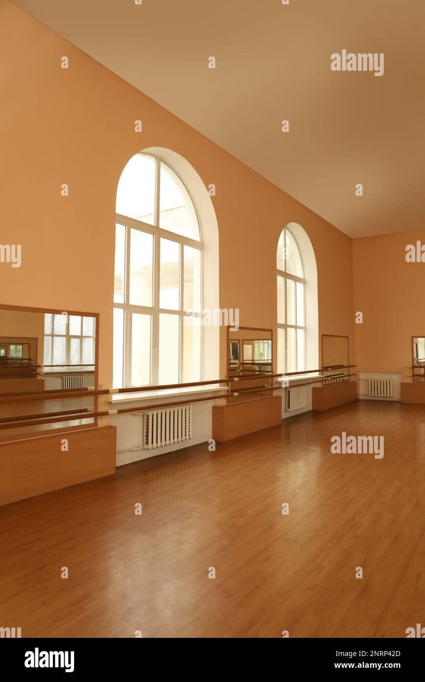 View of empty studio with mirrors and ballet barres Stock Photo - Alamy