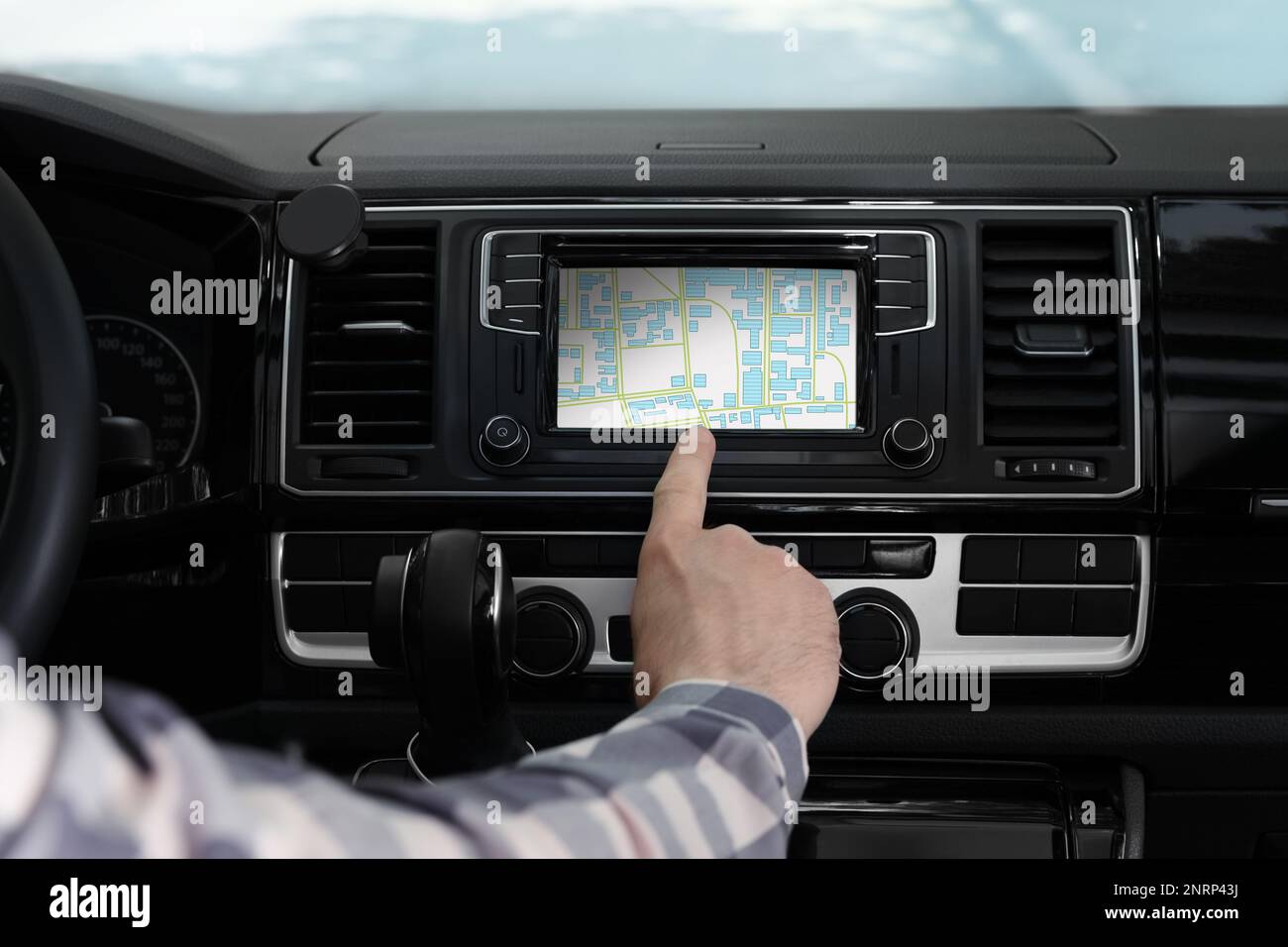 Man using navigation system while driving car, closeup Stock Photo - Alamy Man using navigation system while driving car, closeup Stock Photo - Alamy