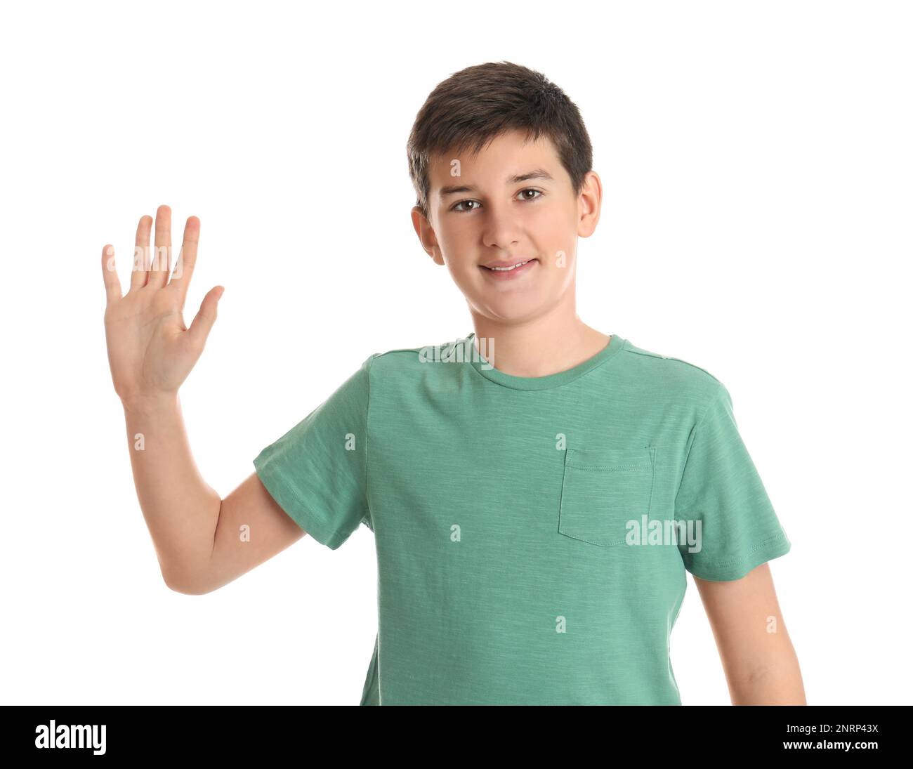 Happy teenage boy waving to say hello on white background Stock Photo ...