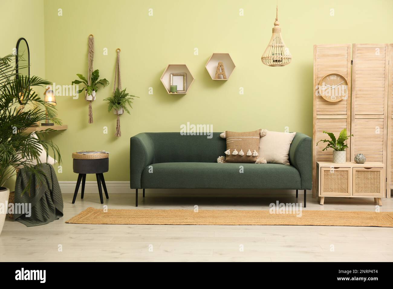 Living room with comfortable green sofa. Interior design Stock Photo ...