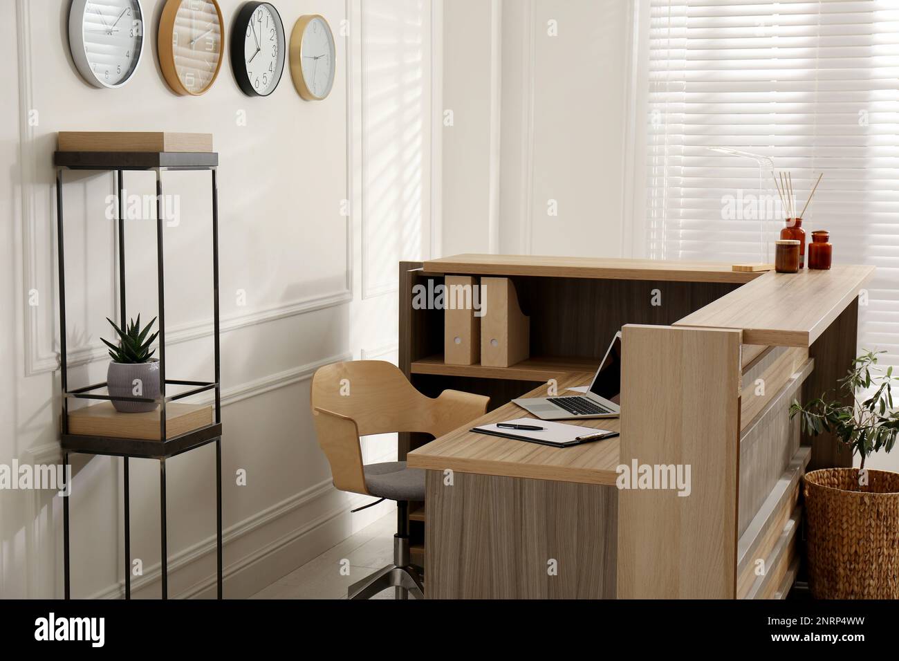Receptionist's workplace with laptop in hotel. Interior design Stock ...