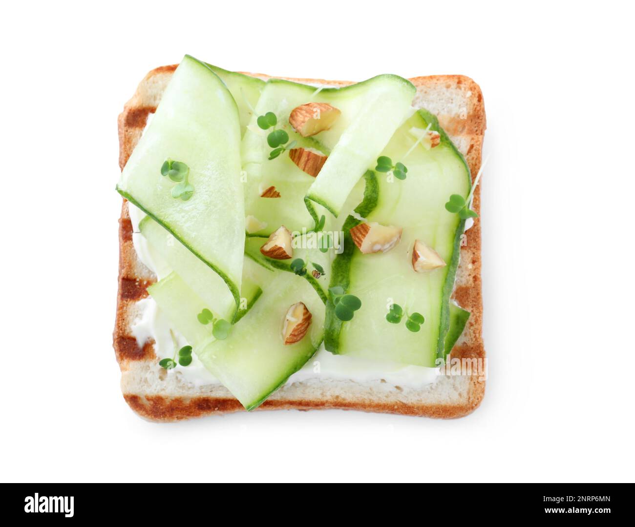 Sandwich with cucumber, cream cheese, microgreens and almond isolated ...