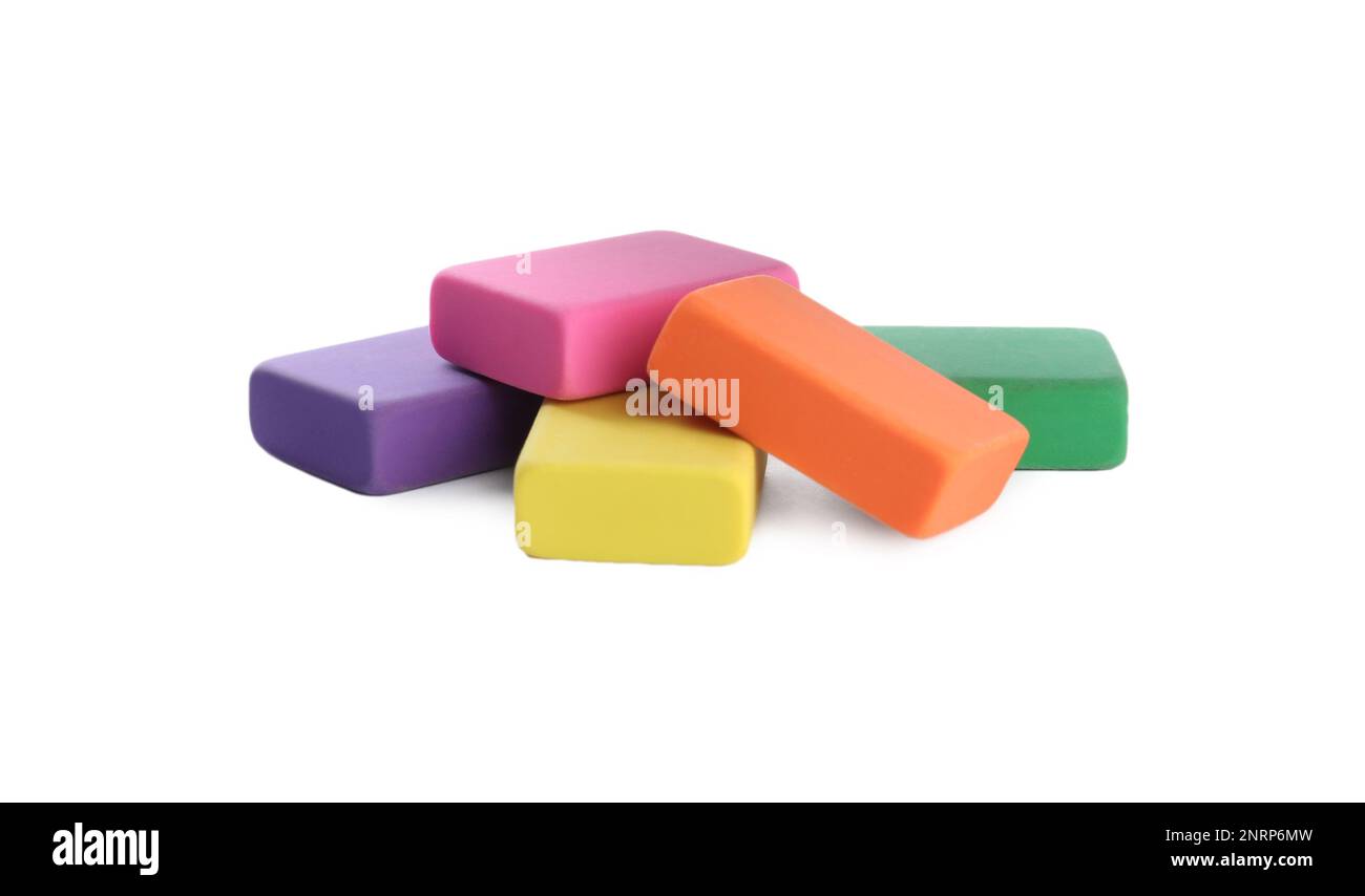 Pile of bright erasers on white background Stock Photo - Alamy