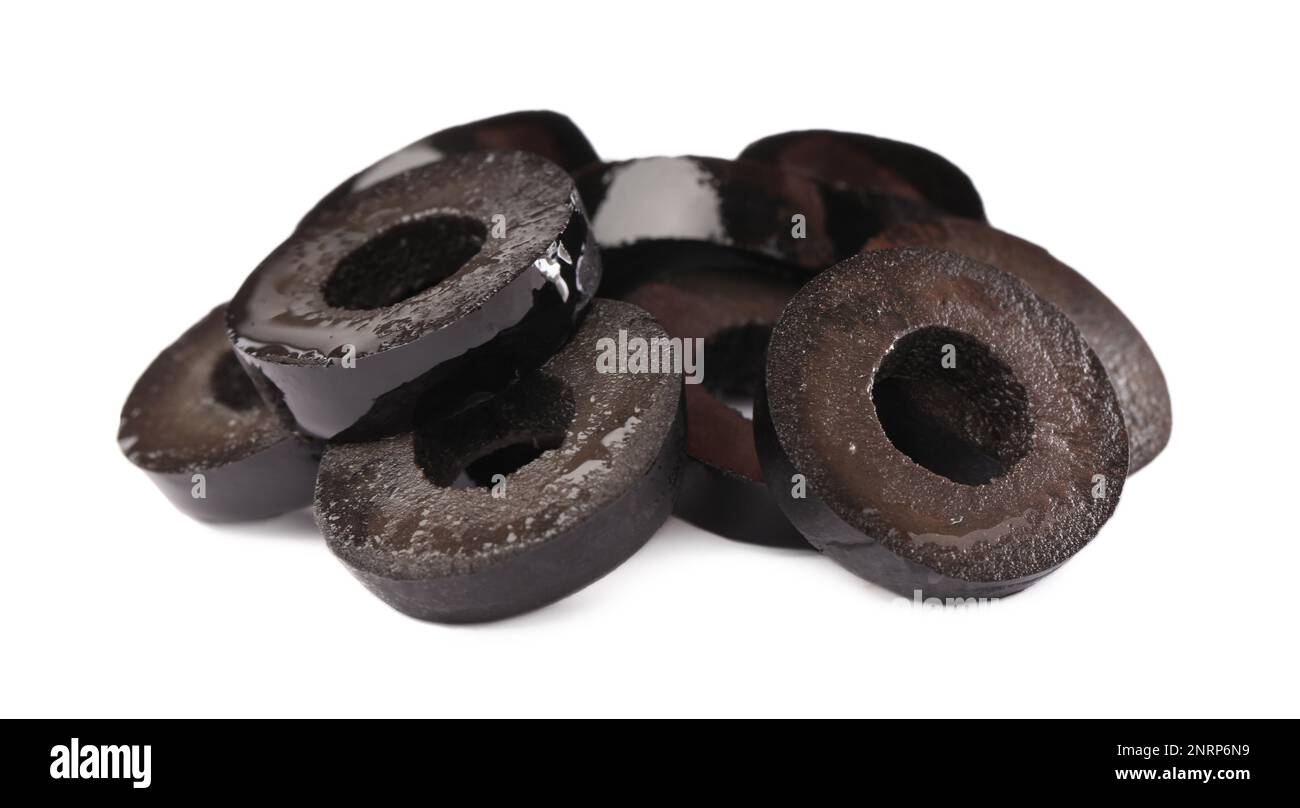Cut fresh black olives on white background Stock Photo - Alamy
