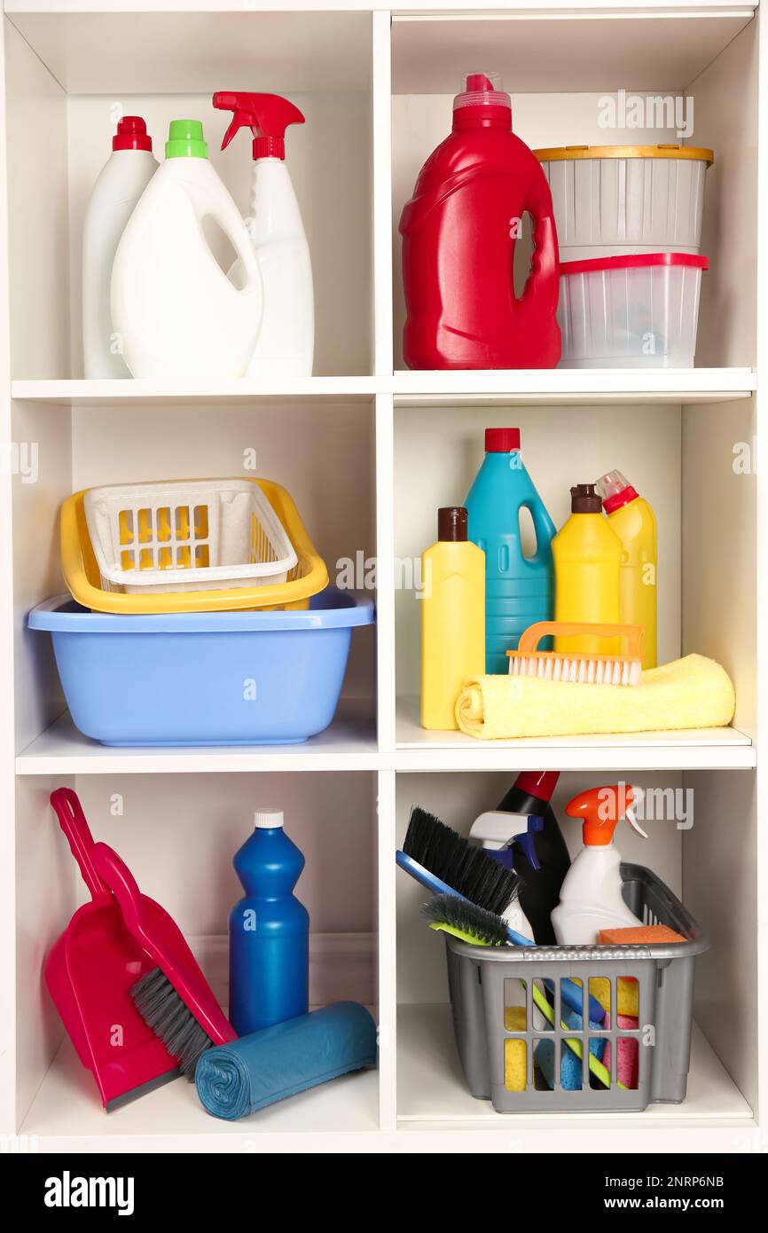 Different cleaning supplies and tools on shelves Stock Photo - Alamy
