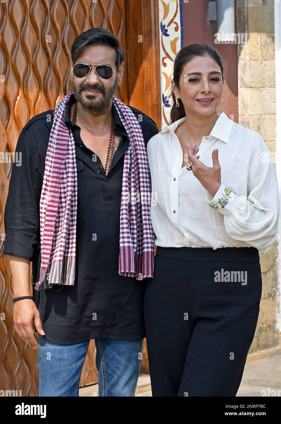 (From L-R) Bollywood actors Ajay Devgn and Tabu pose for photos during ...