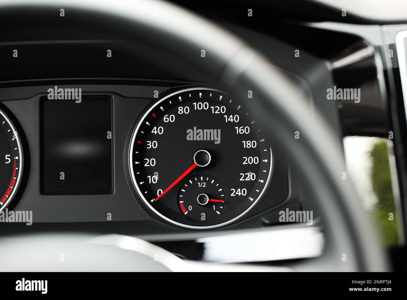 Speedometer on car dashboard, view through steering wheel Stock Photo ...