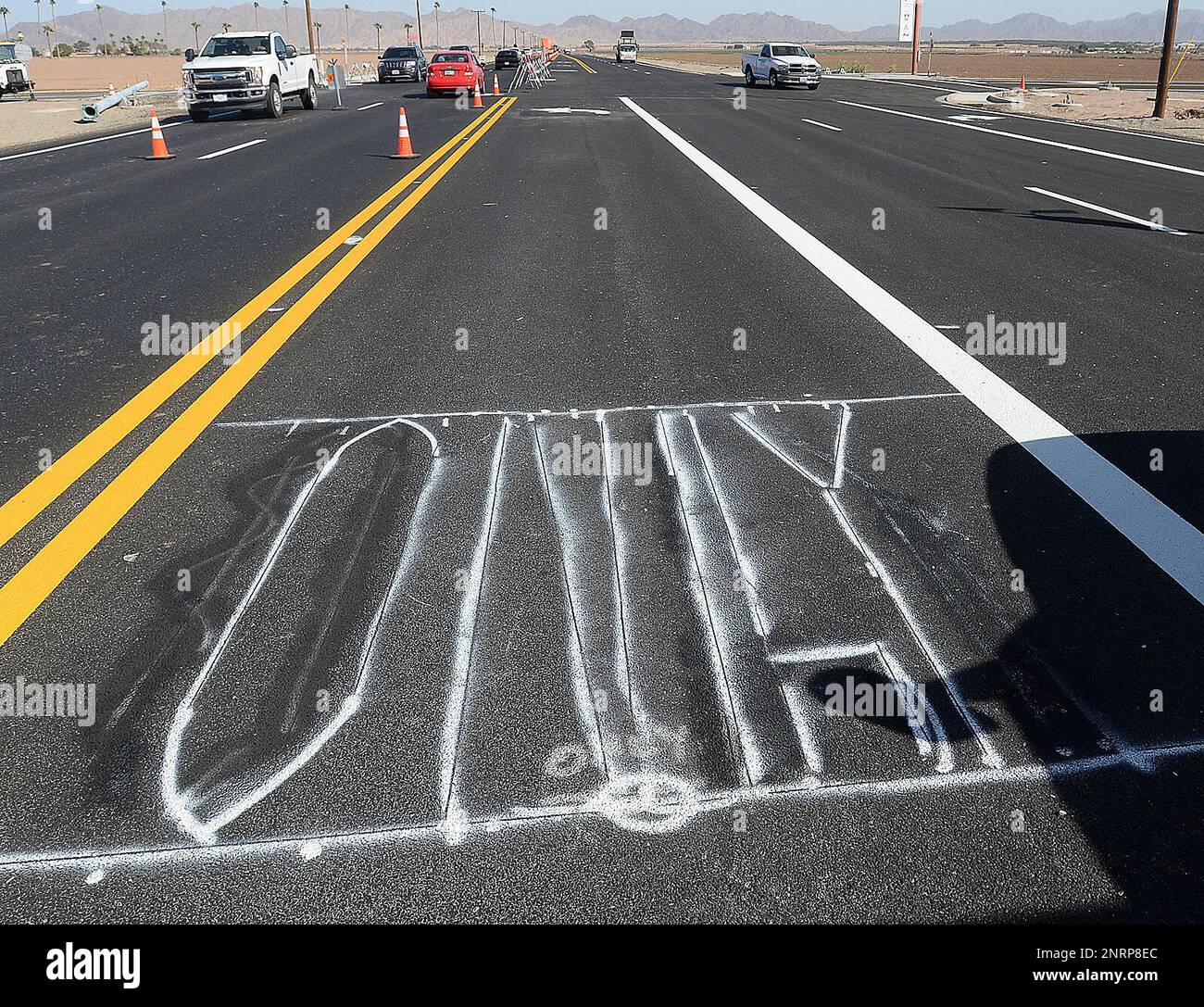 A routhed out "ONLY" sign waits for final paint treatment by workers ...