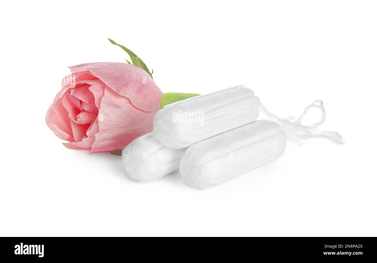 Tampons and beautiful rose on white background Stock Photo - Alamy