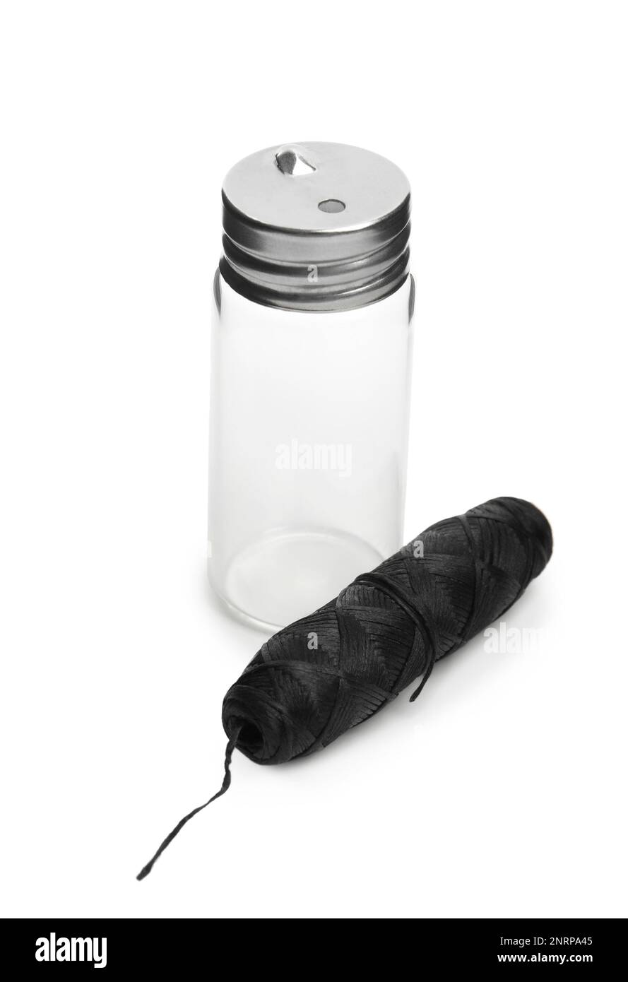 Roll of natural dental floss and jar on white background Stock Photo ...