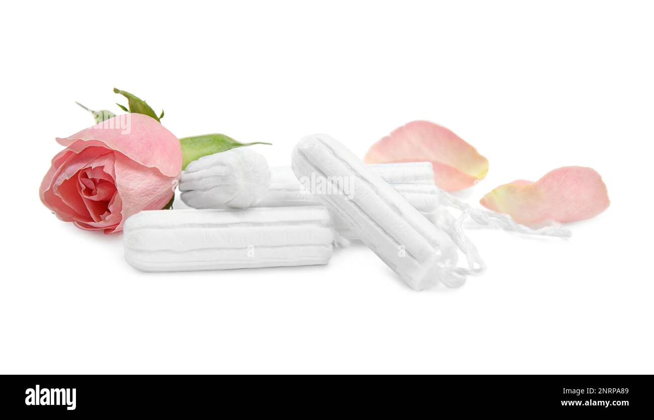 Tampons and beautiful rose on white background Stock Photo - Alamy