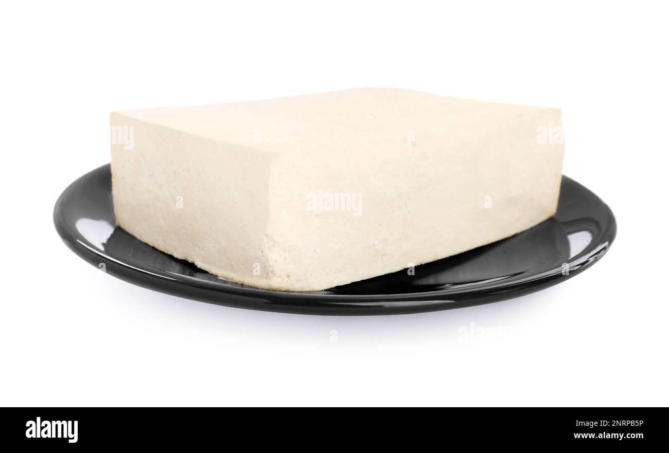 Plate with delicious raw tofu isolated on white Stock Photo - Alamy