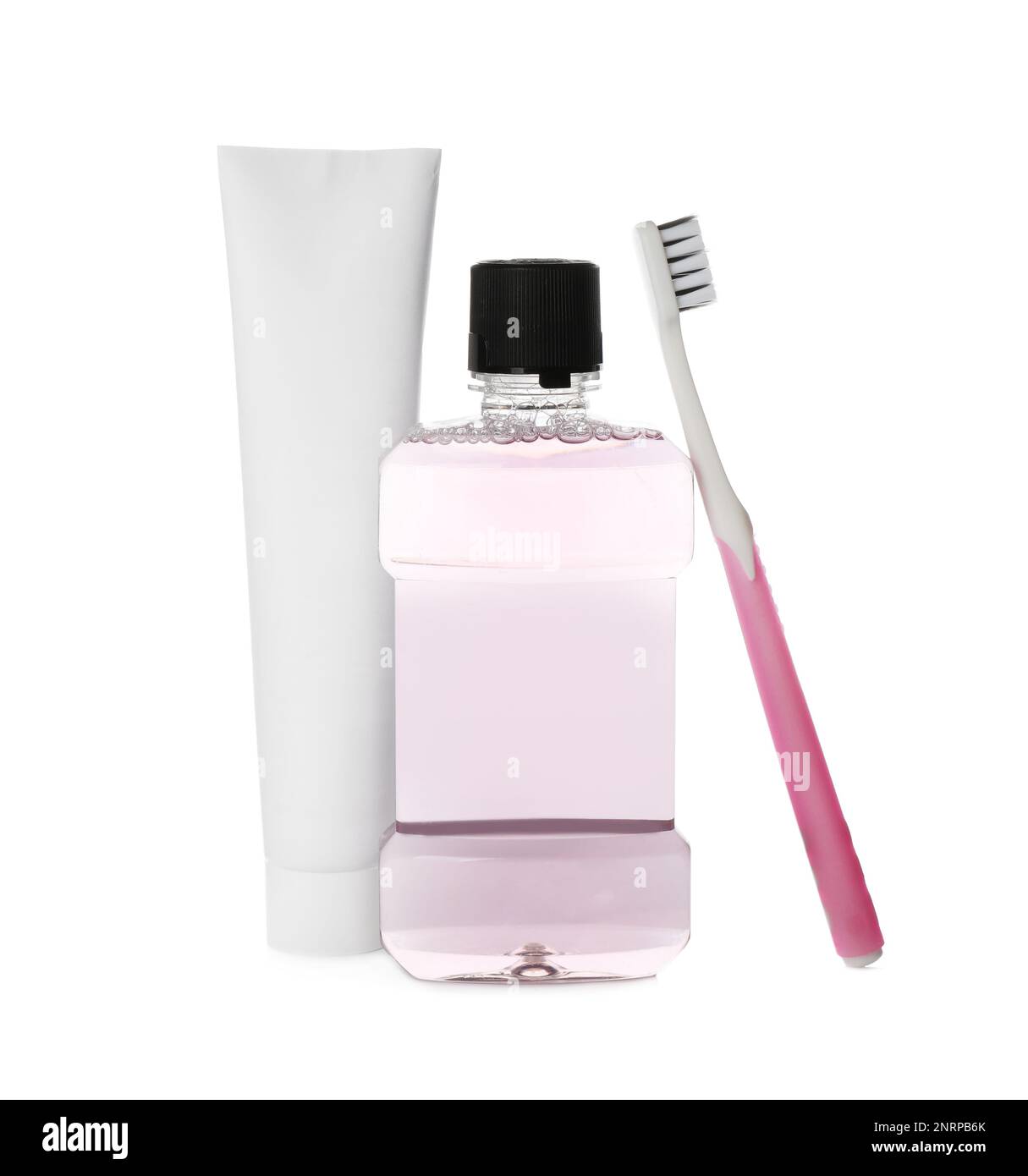 Bottle with mouthwash, toothbrush and paste on white background Stock ...