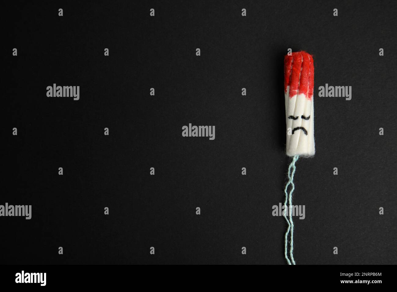 Used tampon on black background, top view. Space for text Stock Photo ...