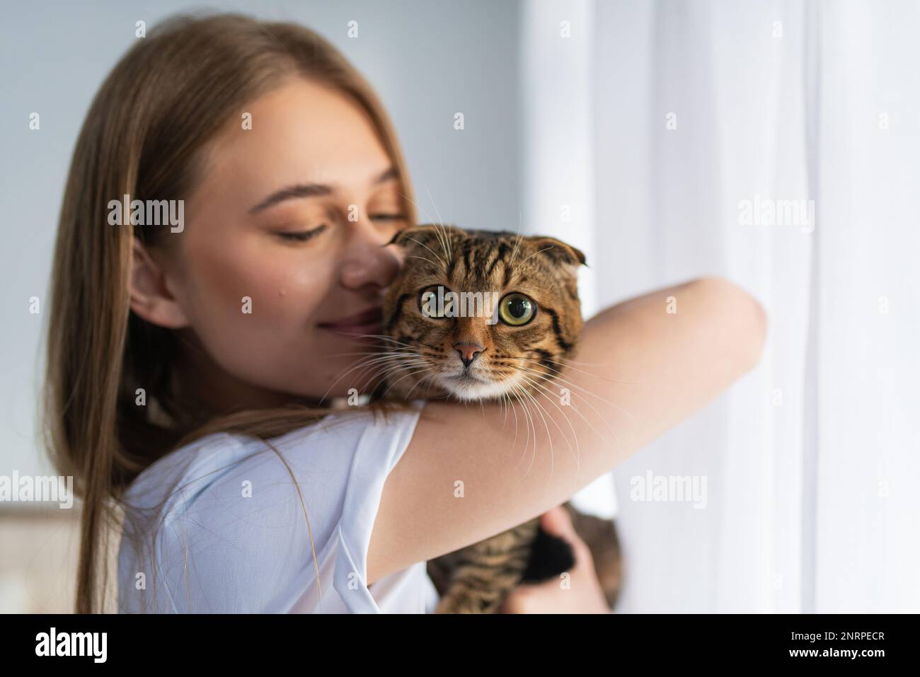 Casual Young Blonde Woman Holds Shoulder a Cute Green-eyed Scottish ...