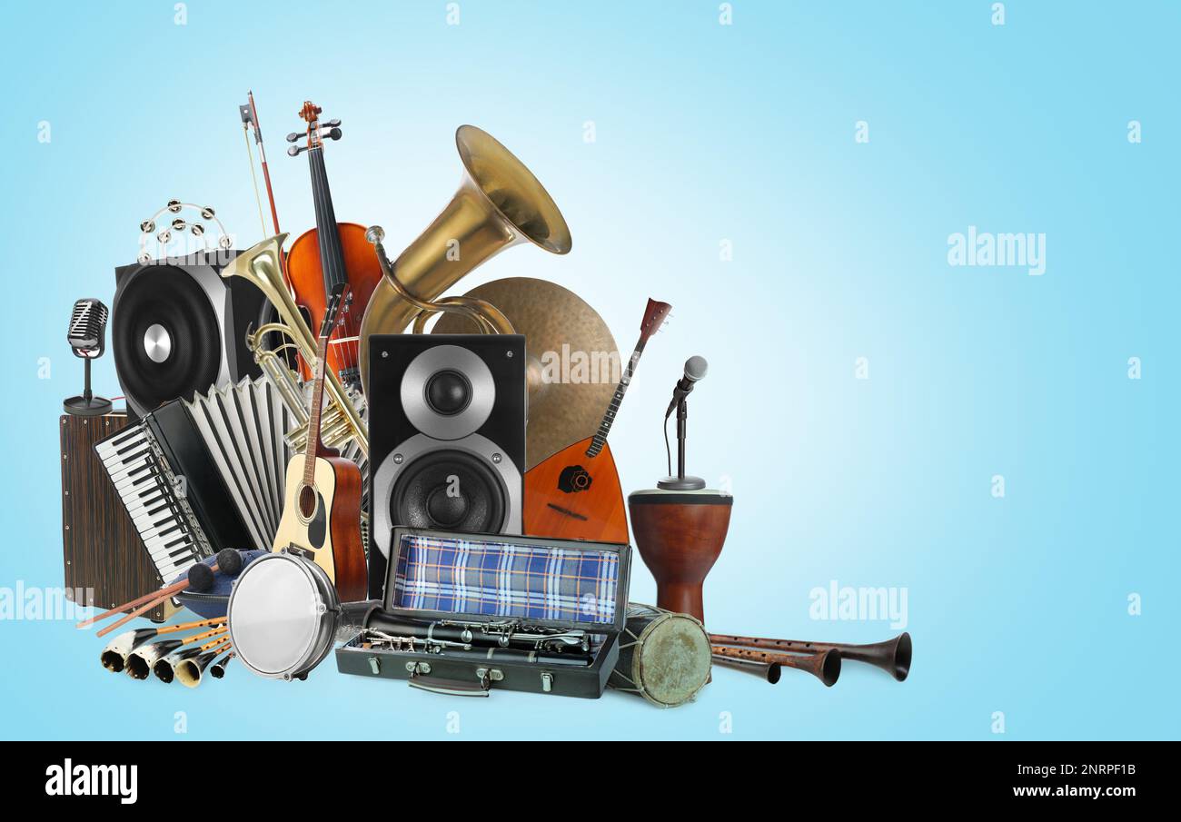 Group of different musical instruments on light blue background Stock ...