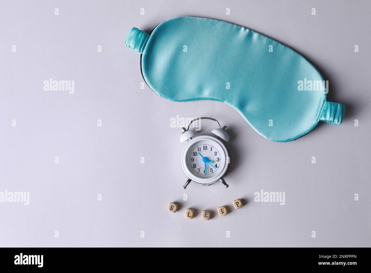 Flat lay composition with word Sleep made of cubes on white background ...