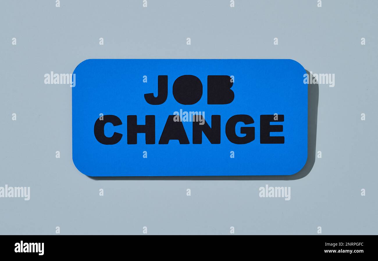 a blue paper sign iwith the text job change in it, on a pale blue ...