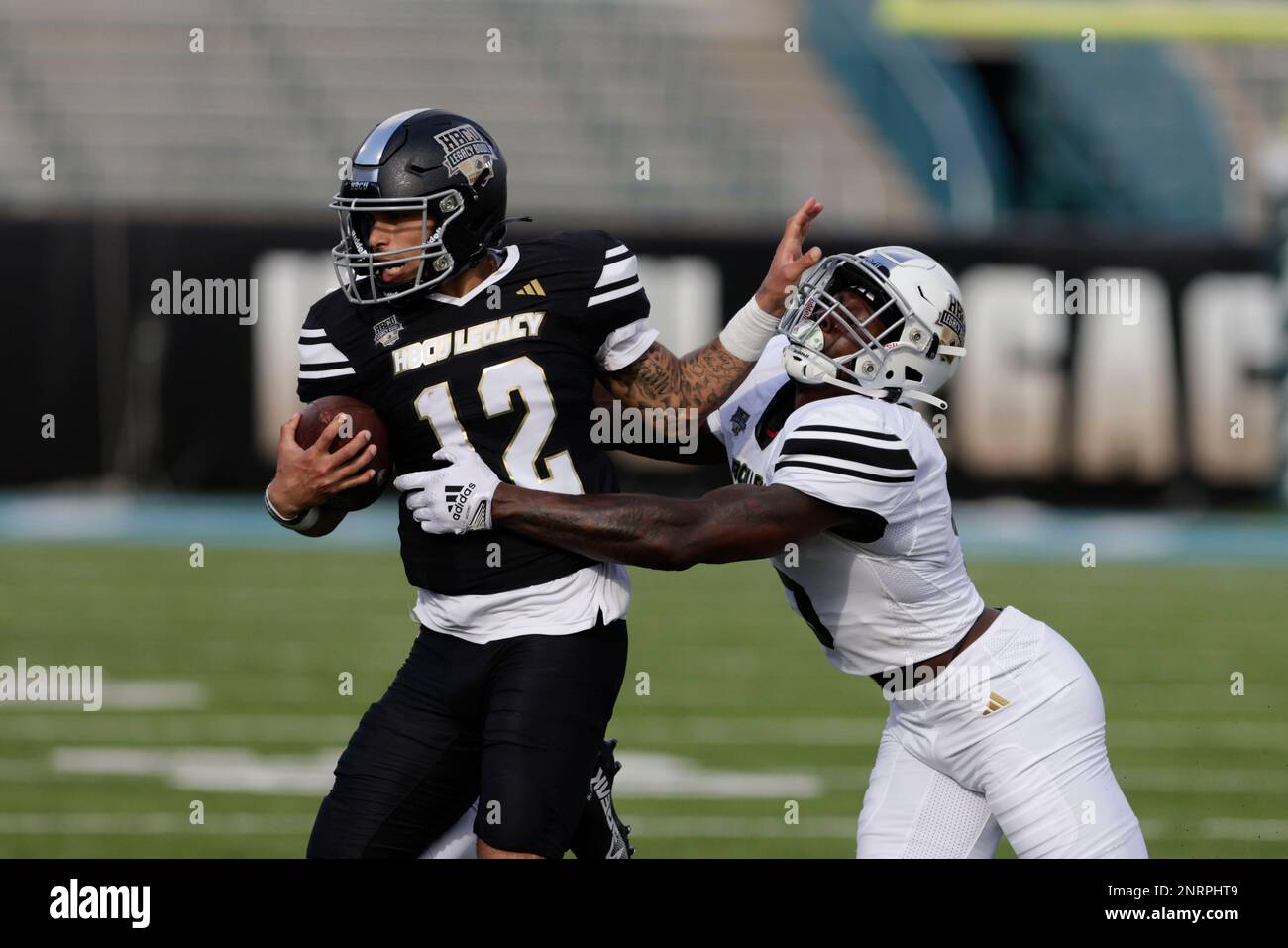 Team Robinson quarterback Glendon McDaniel (12) of Southern carries ...