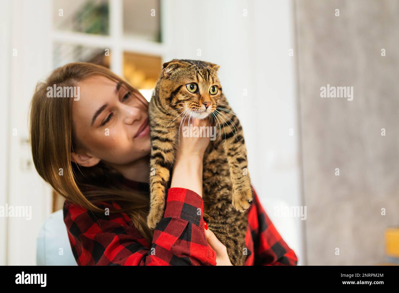 Casual Young Blonde Woman Holds Shoulder a Cute Green-eyed Scottish ...