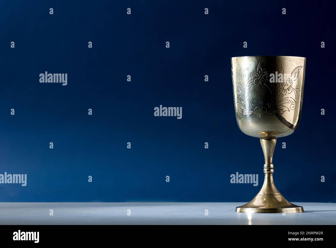 christian chalice on altar blue background blue background Stock Photo ...