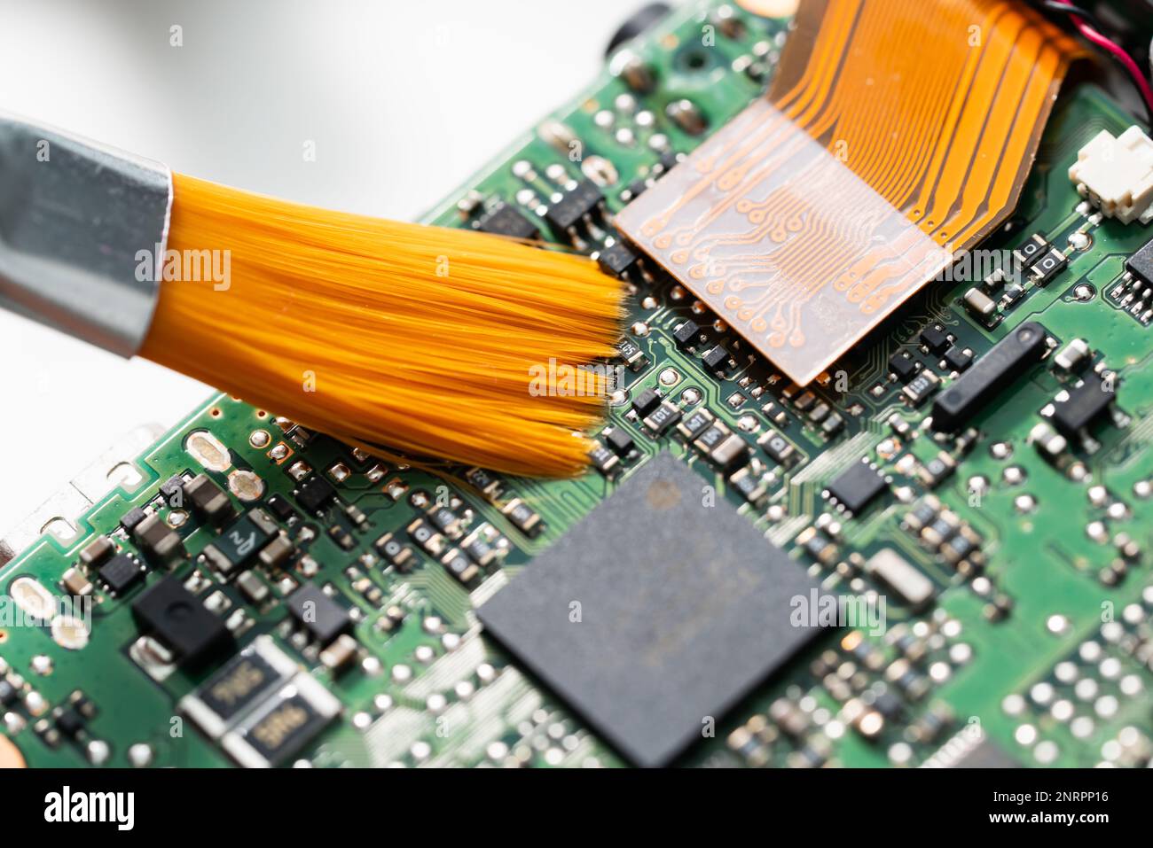 cleaning the electronic board with a brush Stock Photo - Alamy