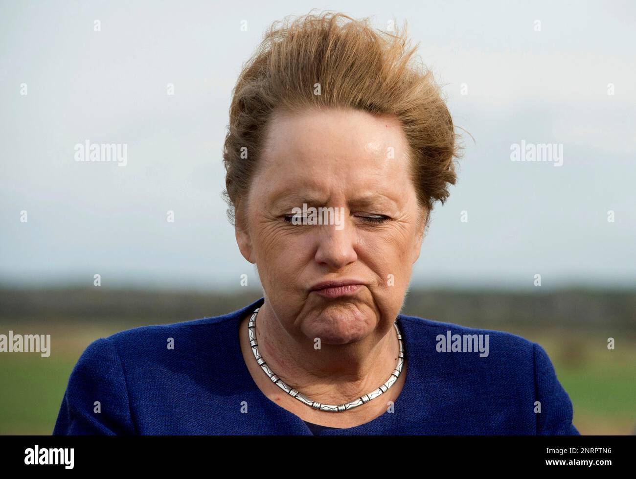 German Chancellor Angela Merkel closes her eyes as the wind blows ...