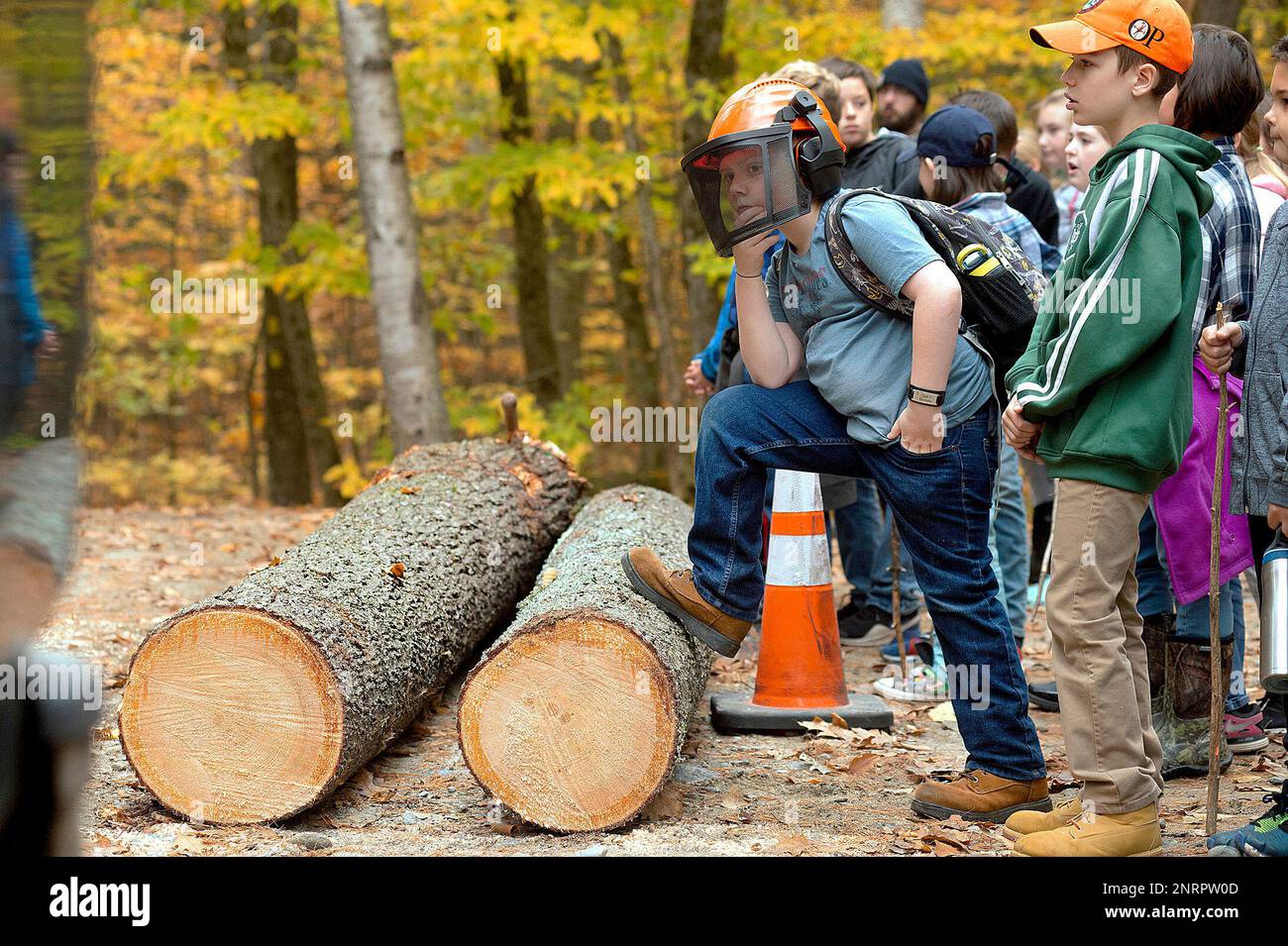 Levi Labbe, 9, watches a sawmill demonstration during his "Timber ...