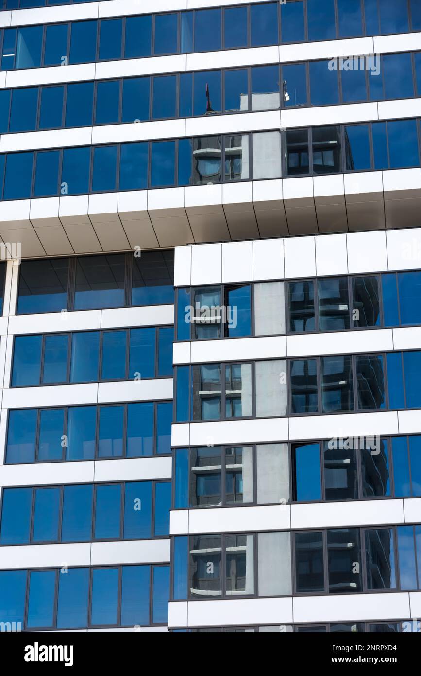 Modern glass facade with reflecting blue sky in the window panes Stock ...