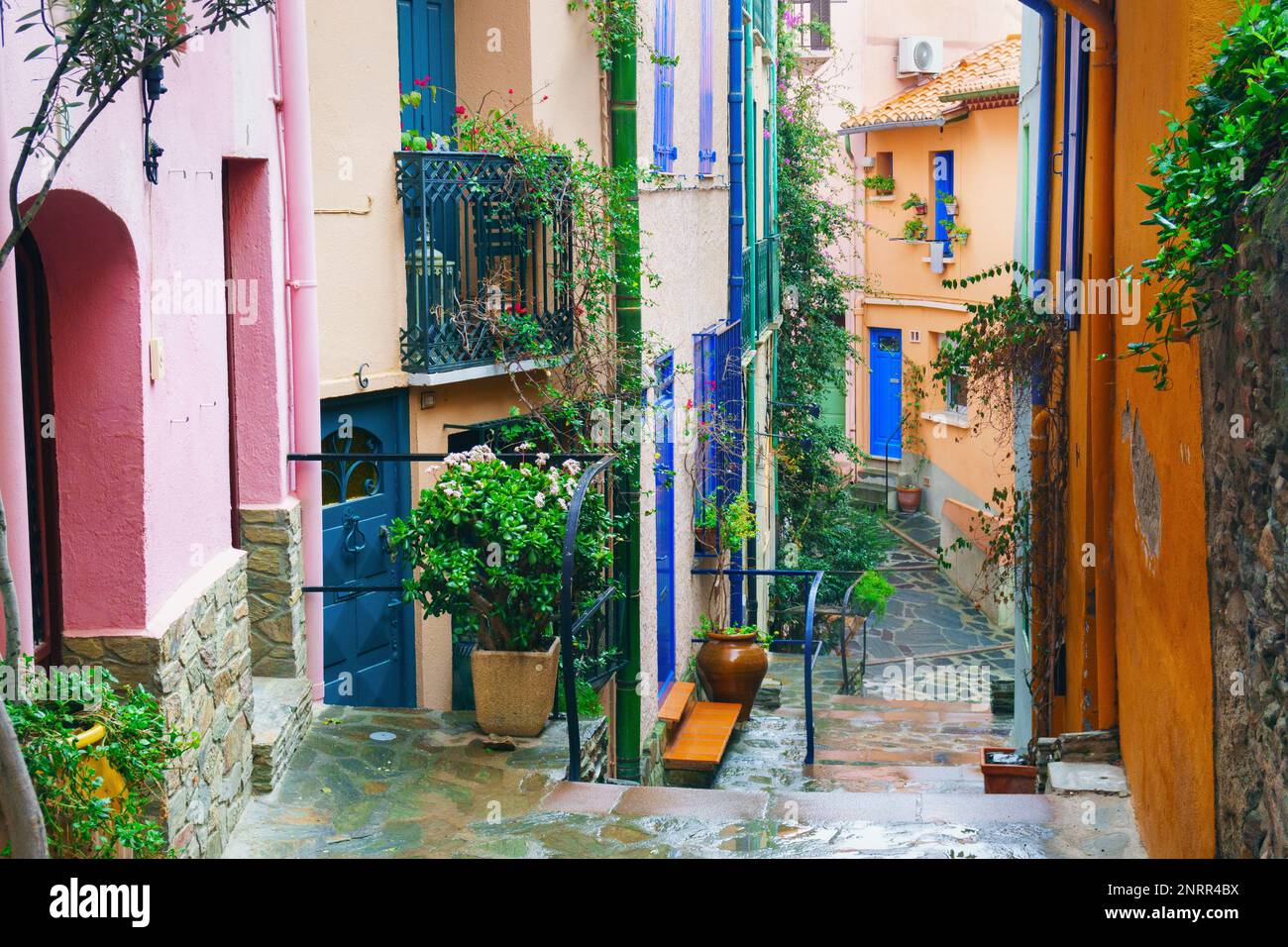 Pretty idylic old mediterranean houses with colorful shuttered windows ...