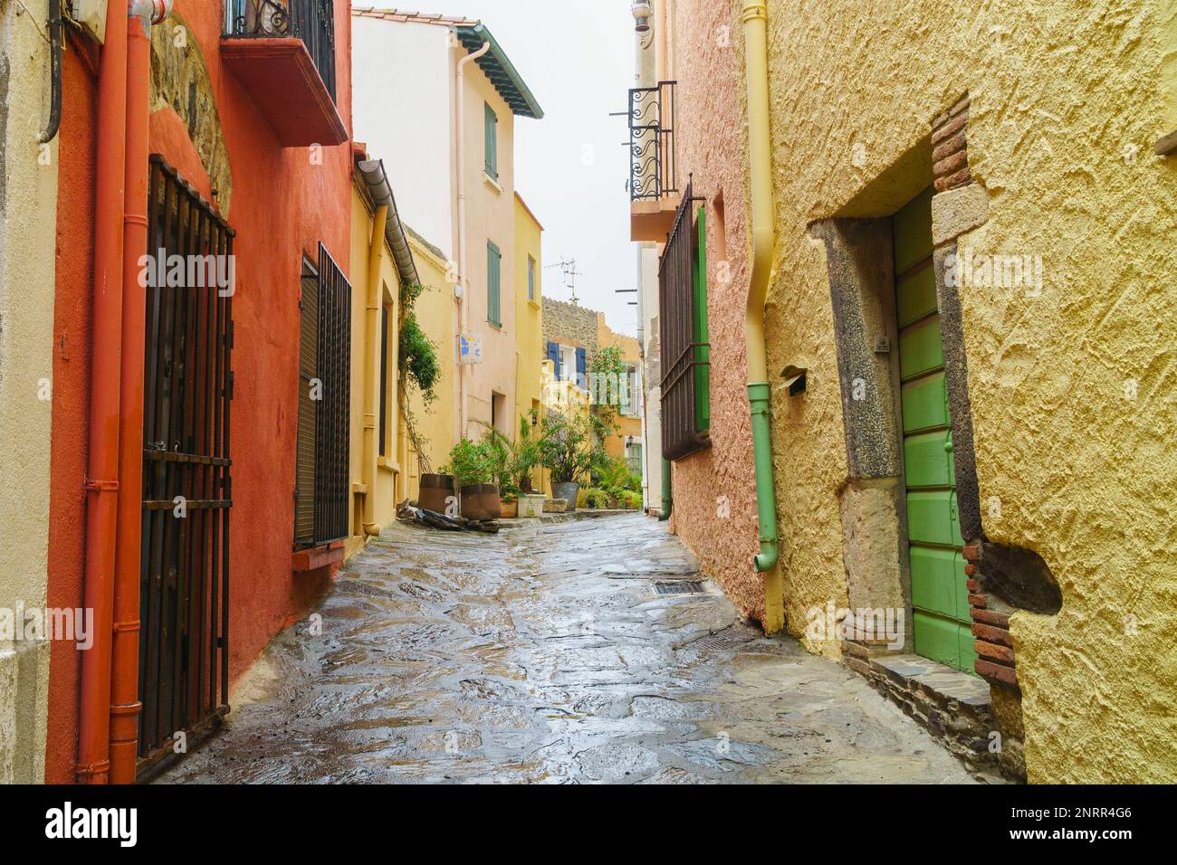 Pretty idylic old mediterranean houses with colorful shuttered windows ...