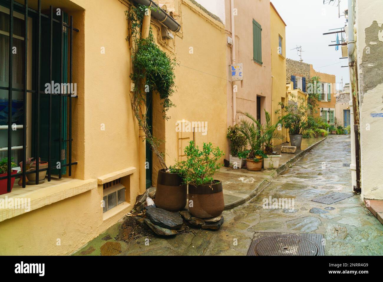 Pretty idylic old mediterranean houses with colorful shuttered windows ...